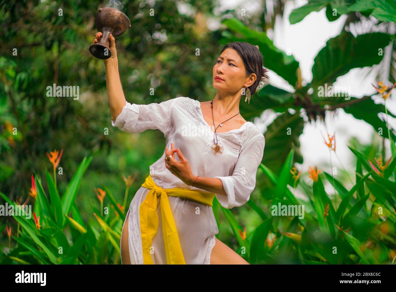 mind and body connection - beautiful and happy healer Asian woman ...