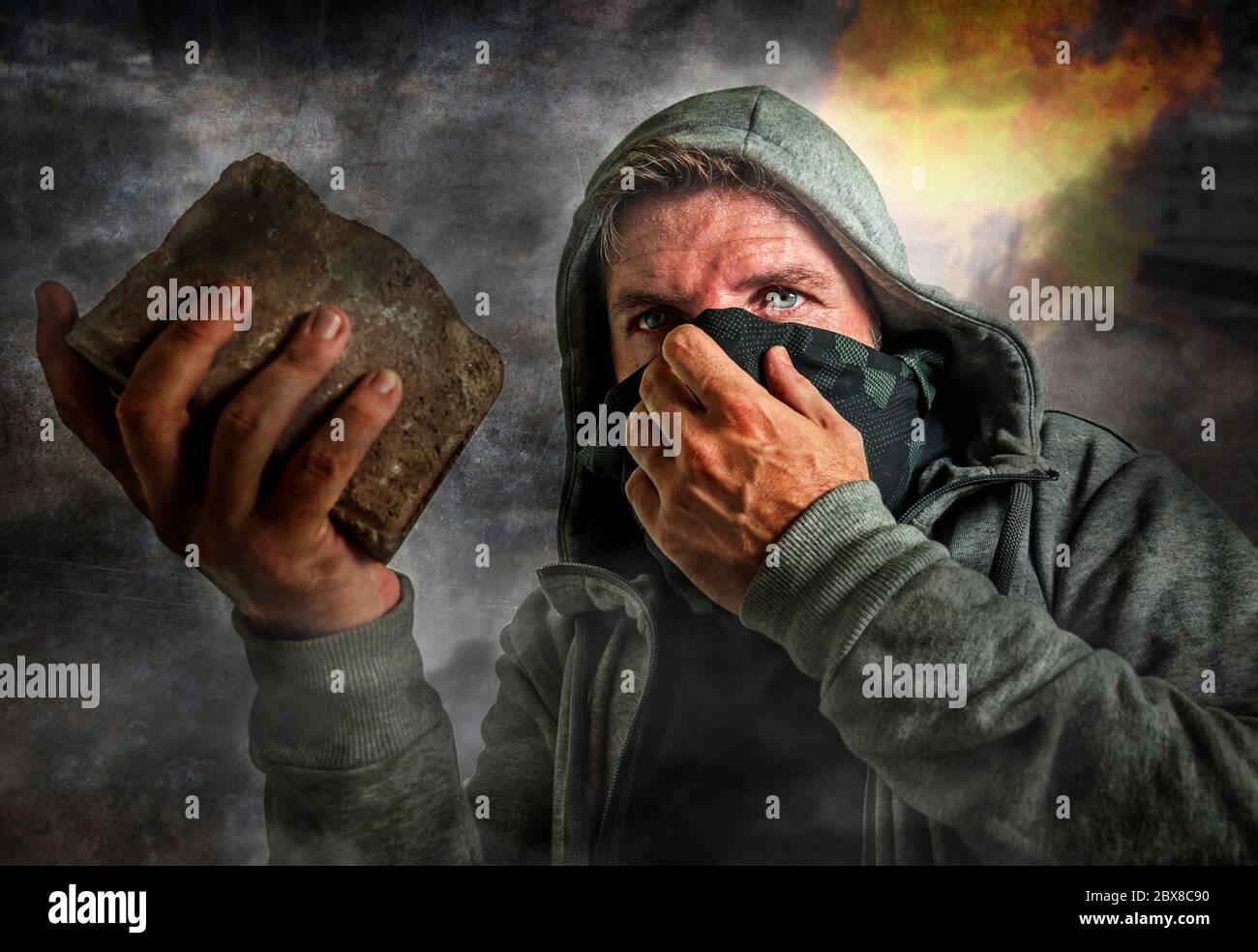 Rioter throwing brick hi-res stock photography and images - Alamy