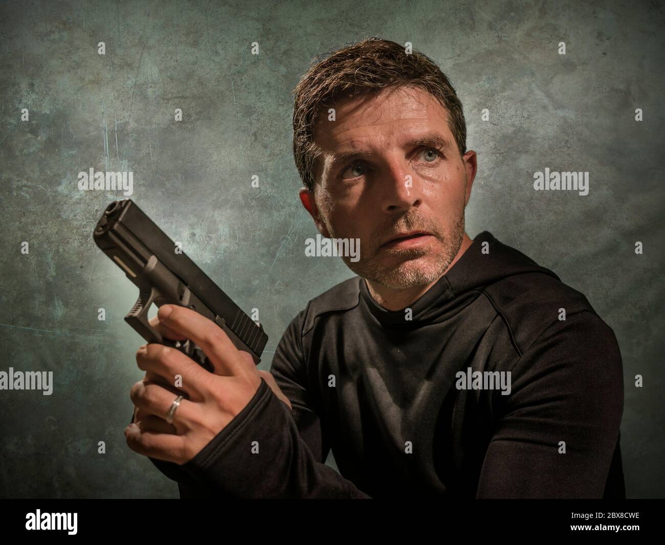 grunge cinematic portrait of attractive and dangerous looking hitman or ...