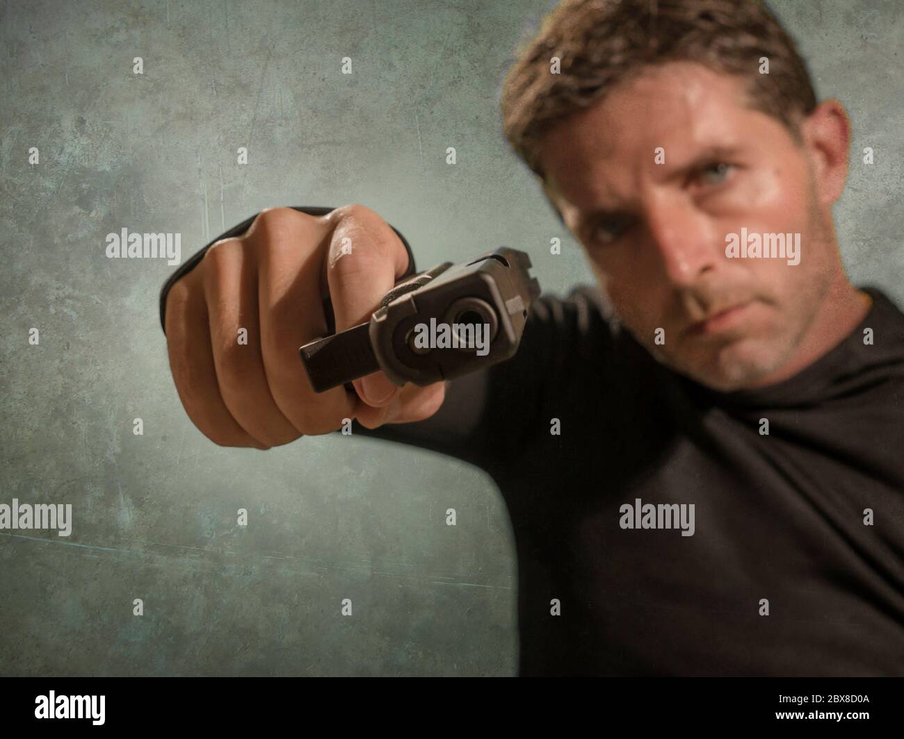 Male police officer pointing handgun hi-res stock photography and ...