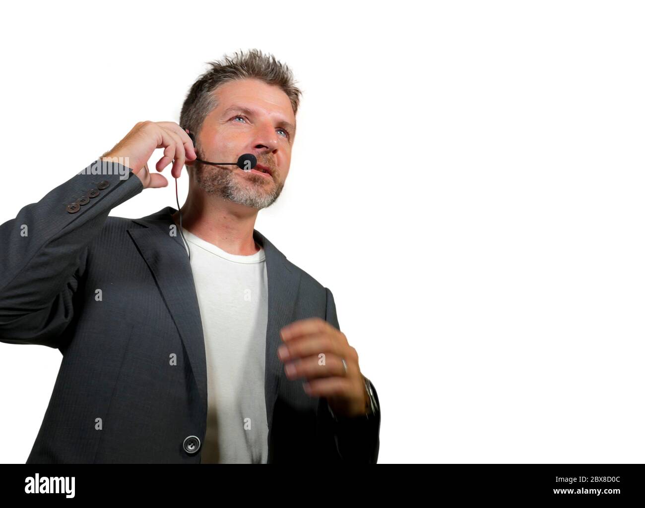 young attractive and confident successful man with headset speaking at ...