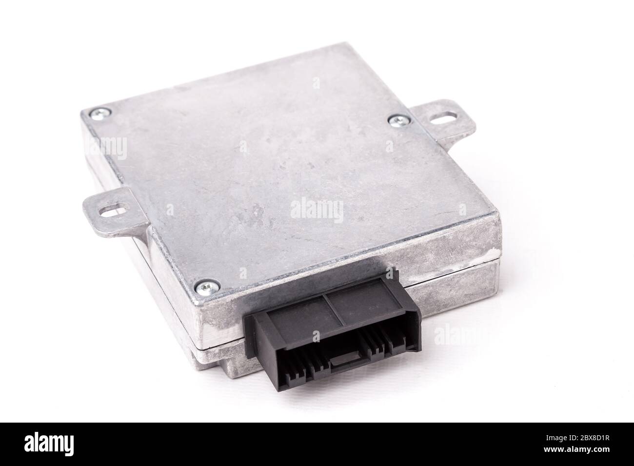 Plastic car engine control unit with metal elements on a white isolated ...