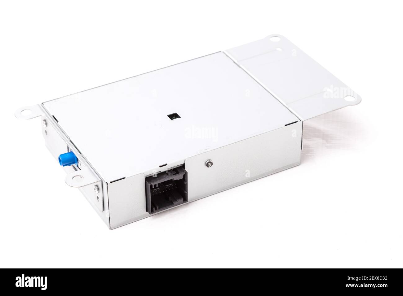 A plastic car engine control unit with metal elements on a white ...