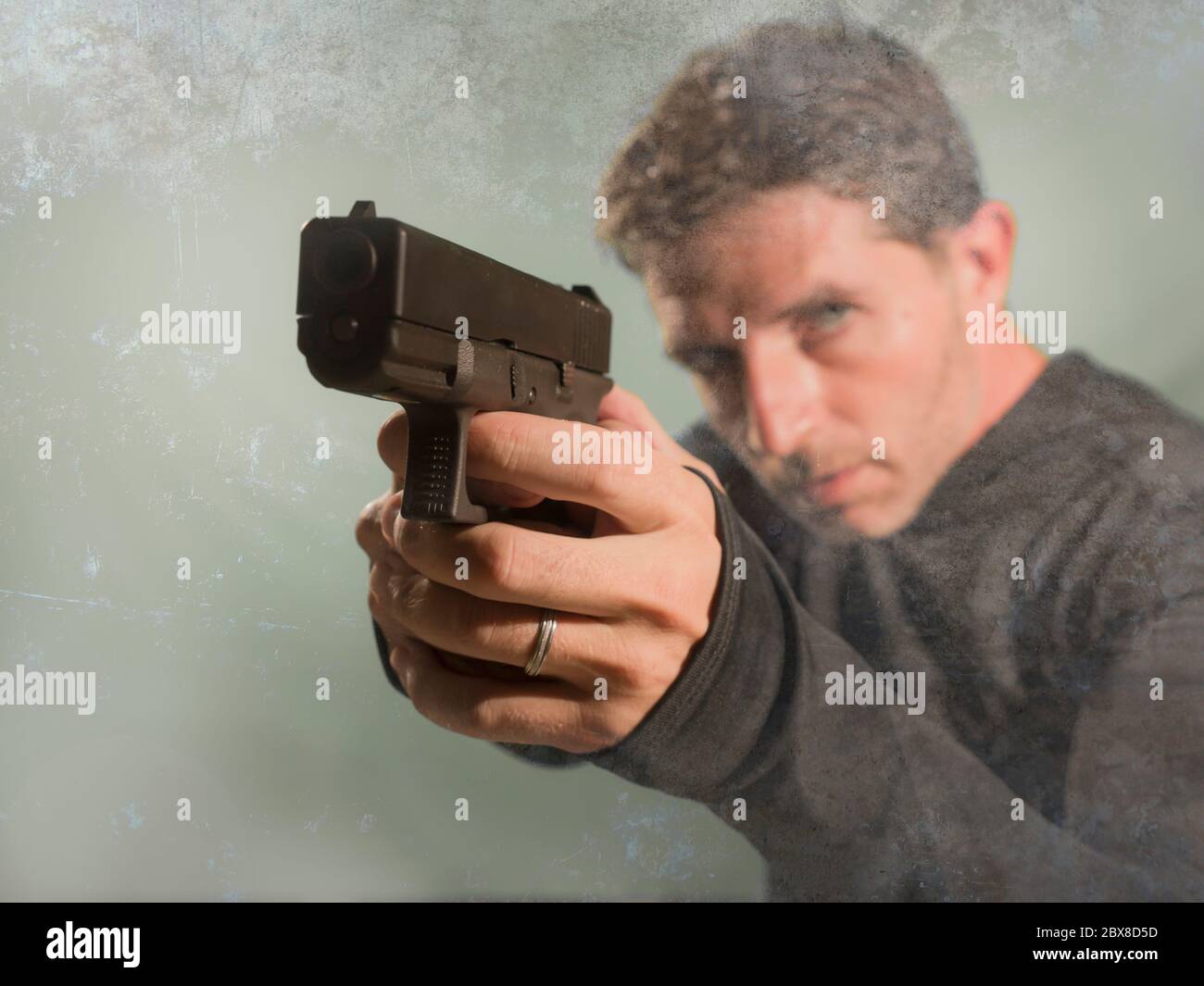 grunge cinematic portrait of attractive and dangerous looking hitman or ...
