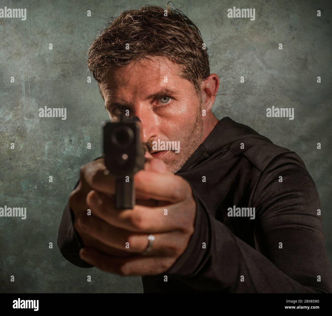 Male police officer pointing handgun hi-res stock photography and ...