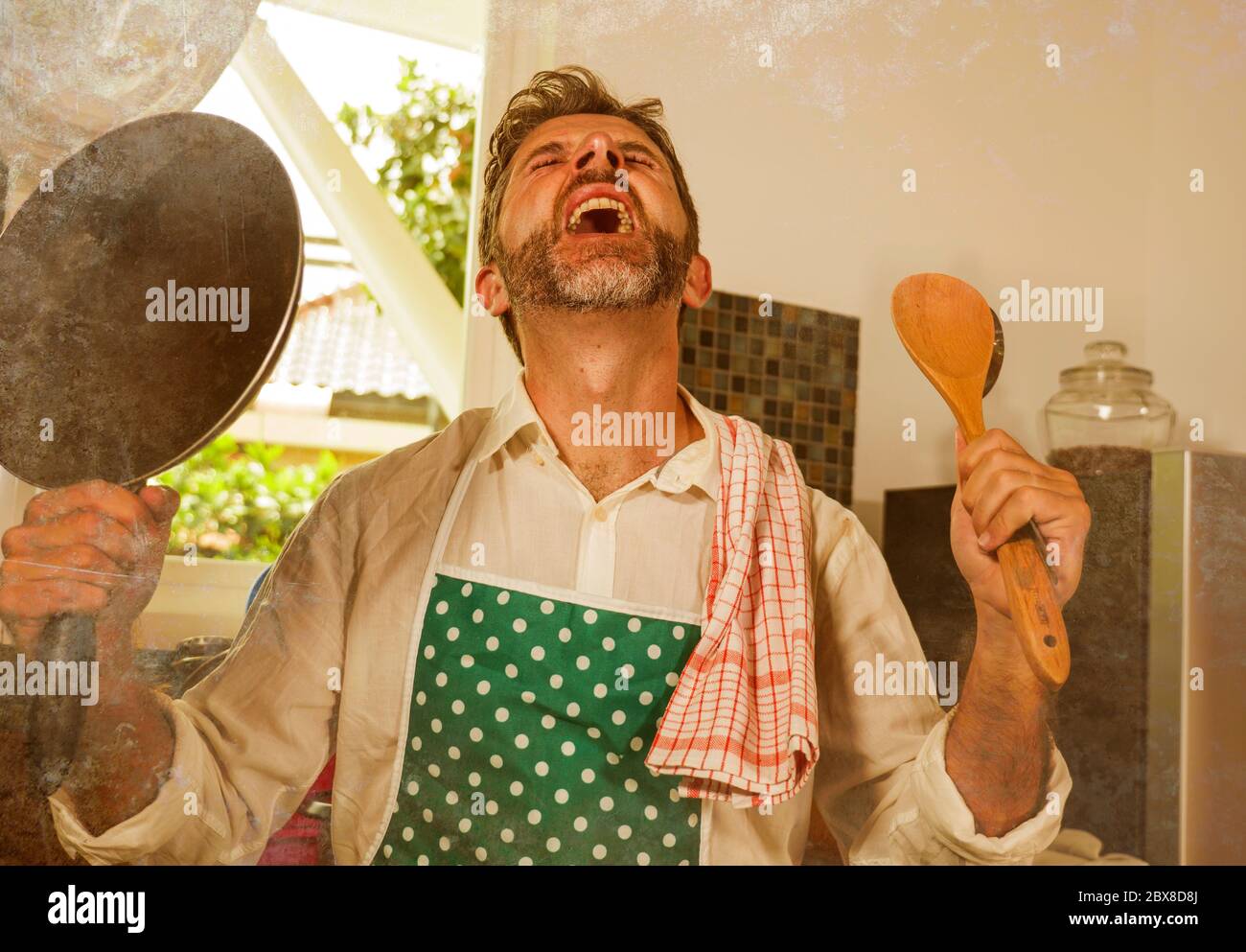 Portrait adult sad man cooking hi-res stock photography and images - Alamy