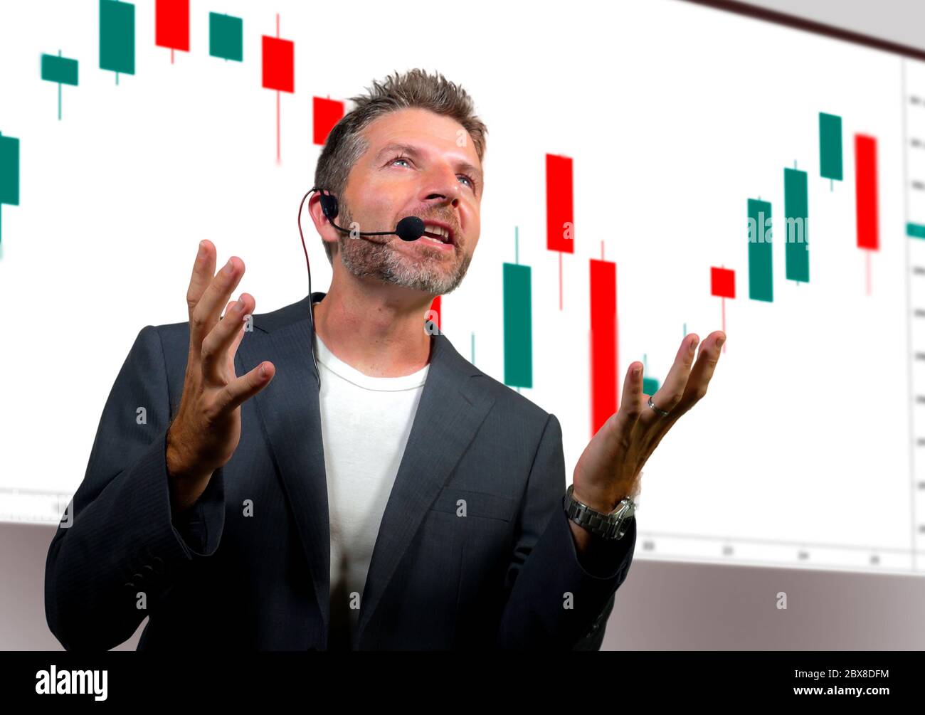 attractive and confident successful trader man with headset speaking at ...