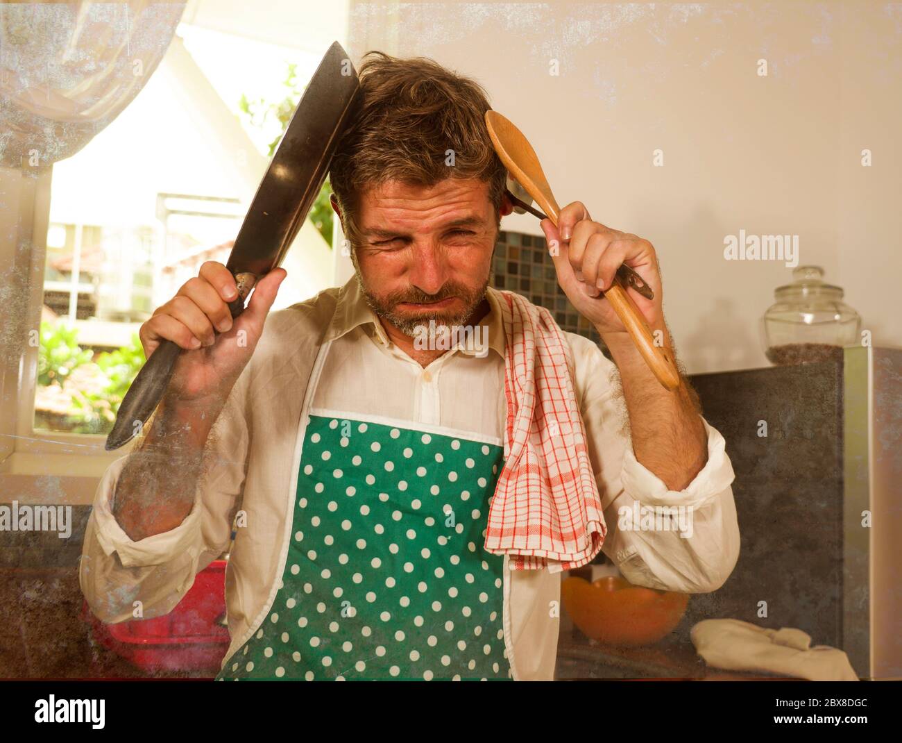 Portrait adult sad man cooking hi-res stock photography and images - Alamy