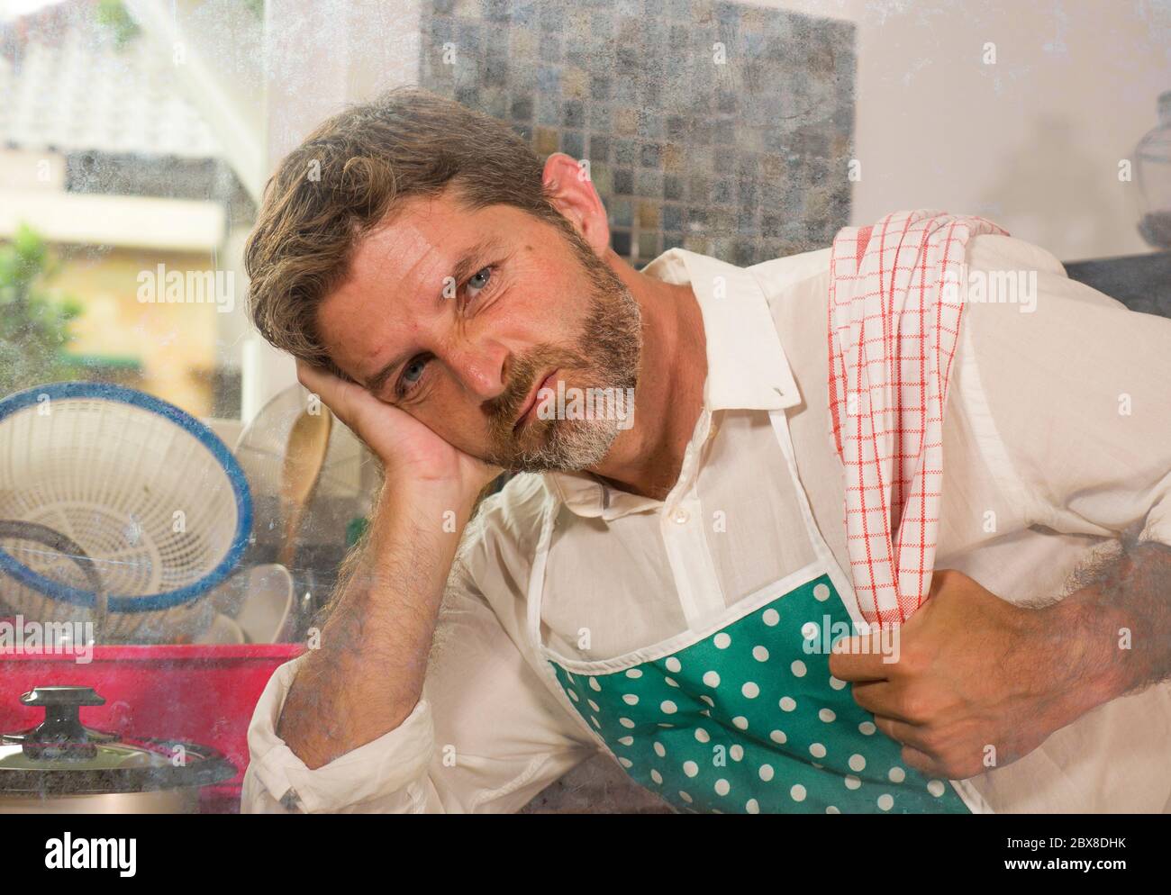 Portrait adult sad man cooking hi-res stock photography and images - Alamy