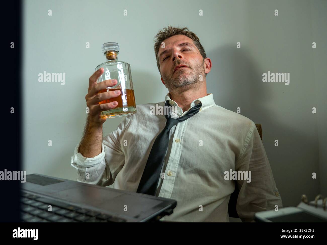 alcohol addict businessman - dramatic portrait of alcoholic man in lose ...