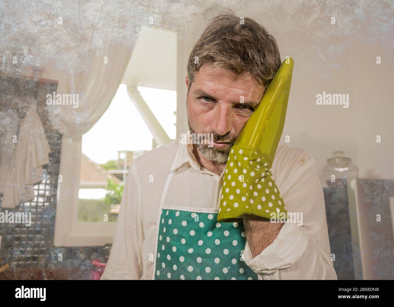 Portrait adult sad man cooking hi-res stock photography and images - Alamy