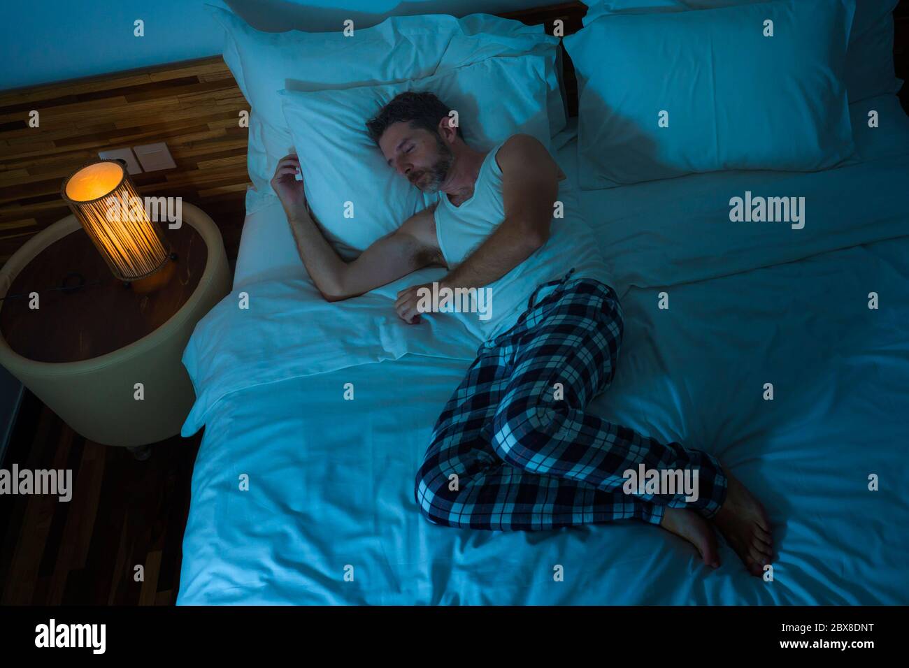Man sleeping bed hi-res stock photography and images - Alamy