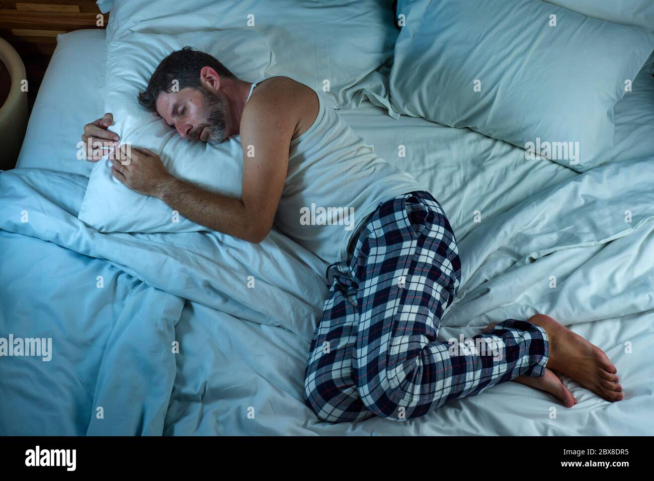 domestic lifestyle high angle portrait of young attractive and relaxed ...