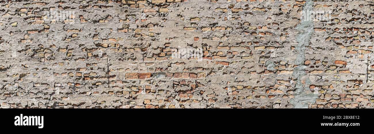 wide brick wall with dirty rough stucco. Panoramic view. layout design ...