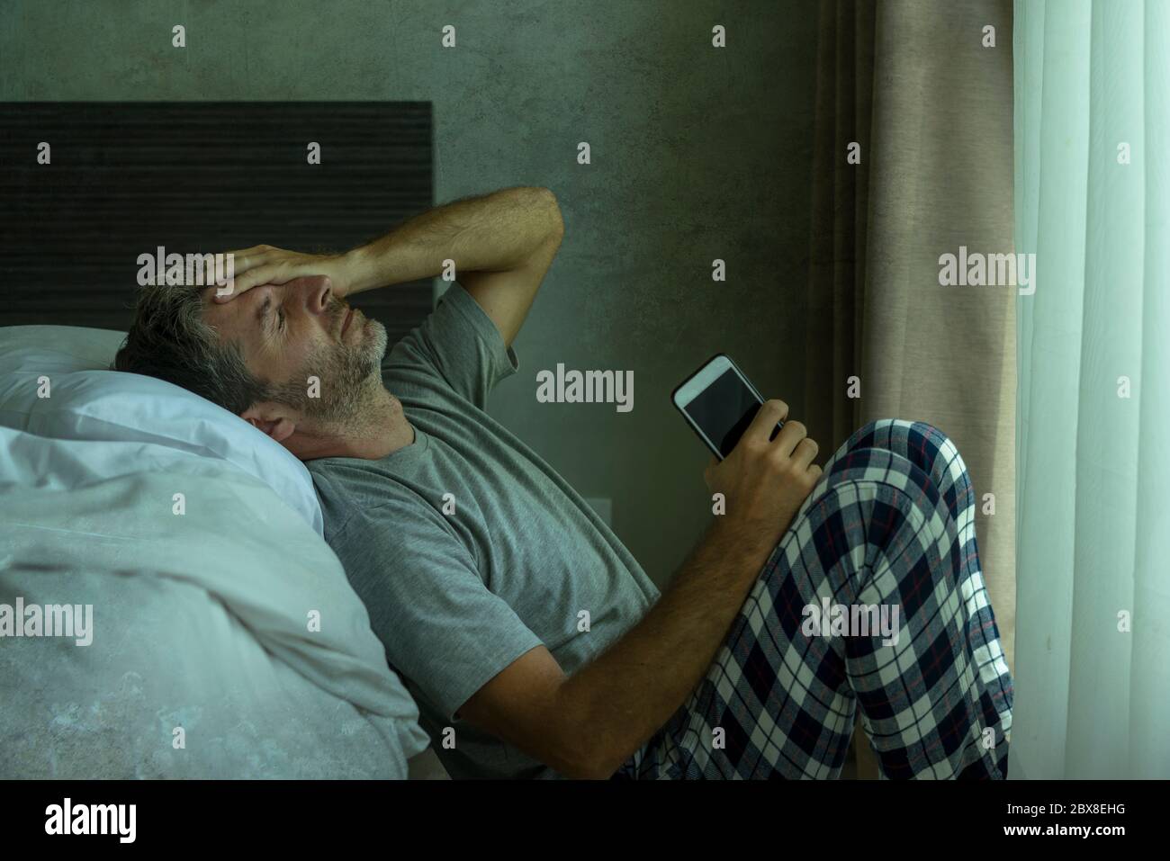 dramatic indoors portrait of mid adult man crying sad and depressed at ...