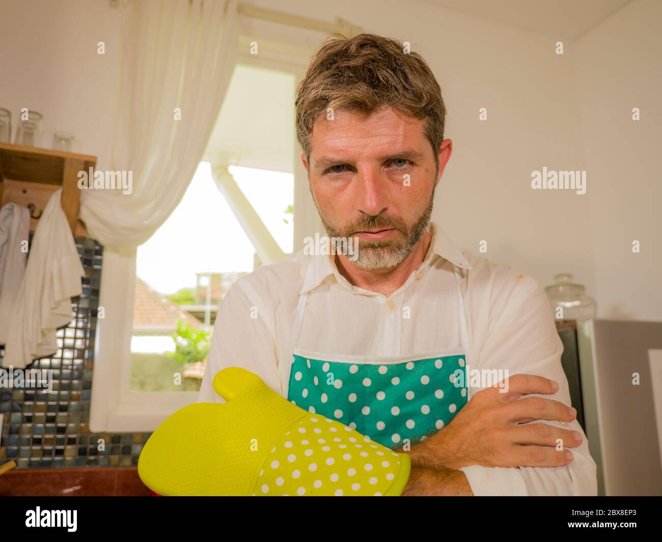 funny lifestyle portrait of mid adult unhappy and stressed man in ...