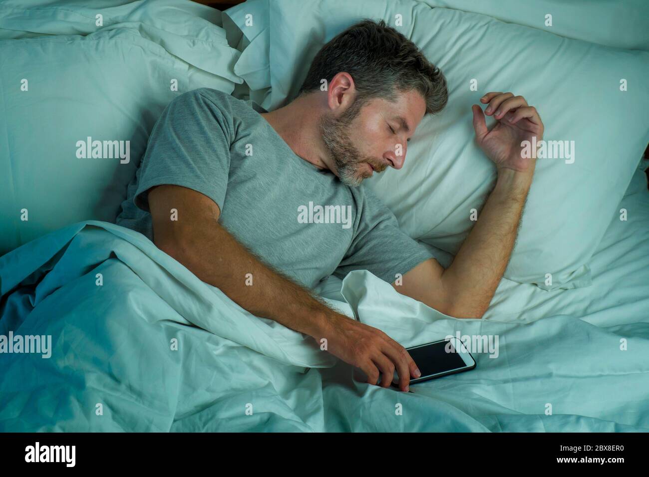 domestic lifestyle high angle portrait of young attractive and tired ...