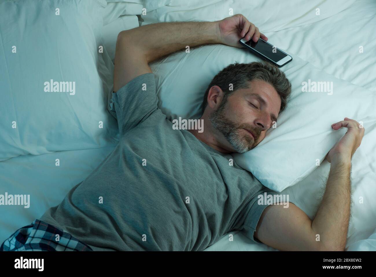 domestic lifestyle high angle portrait of young attractive and tired ...