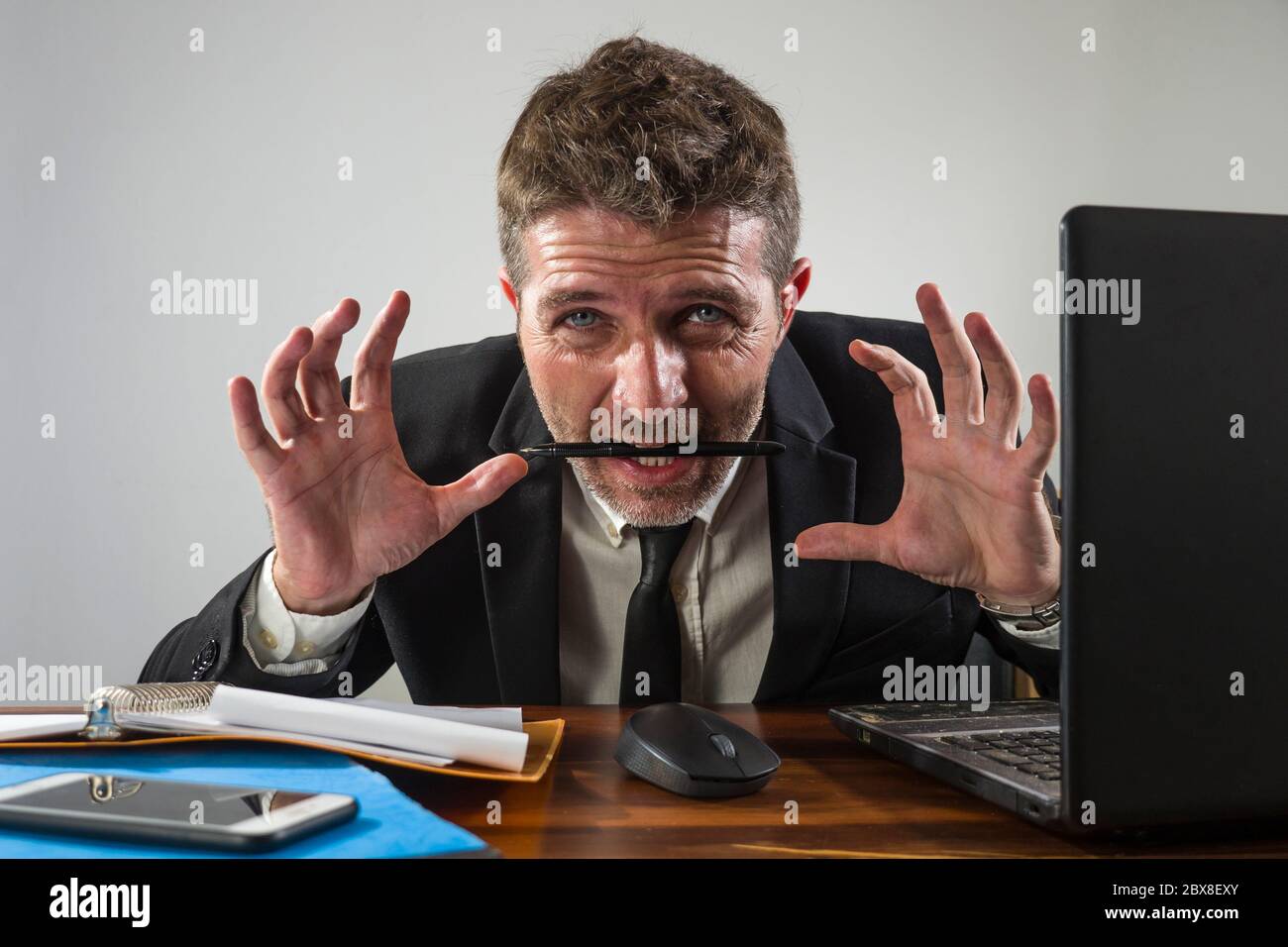 corporate business work stress - young desperate and frustrated ...