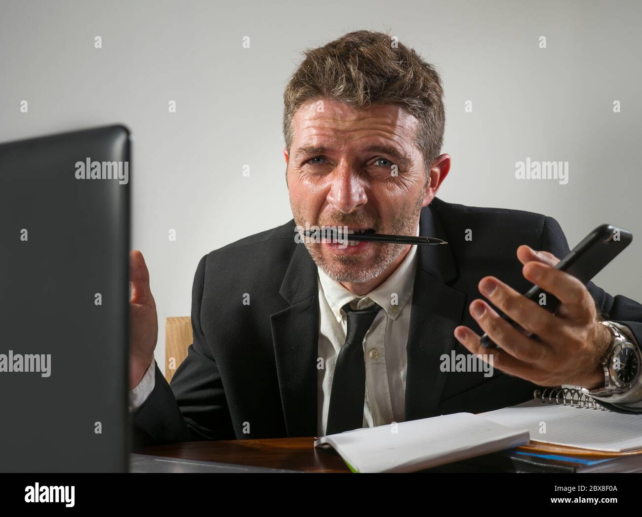 corporate business work stress - young desperate and frustrated ...