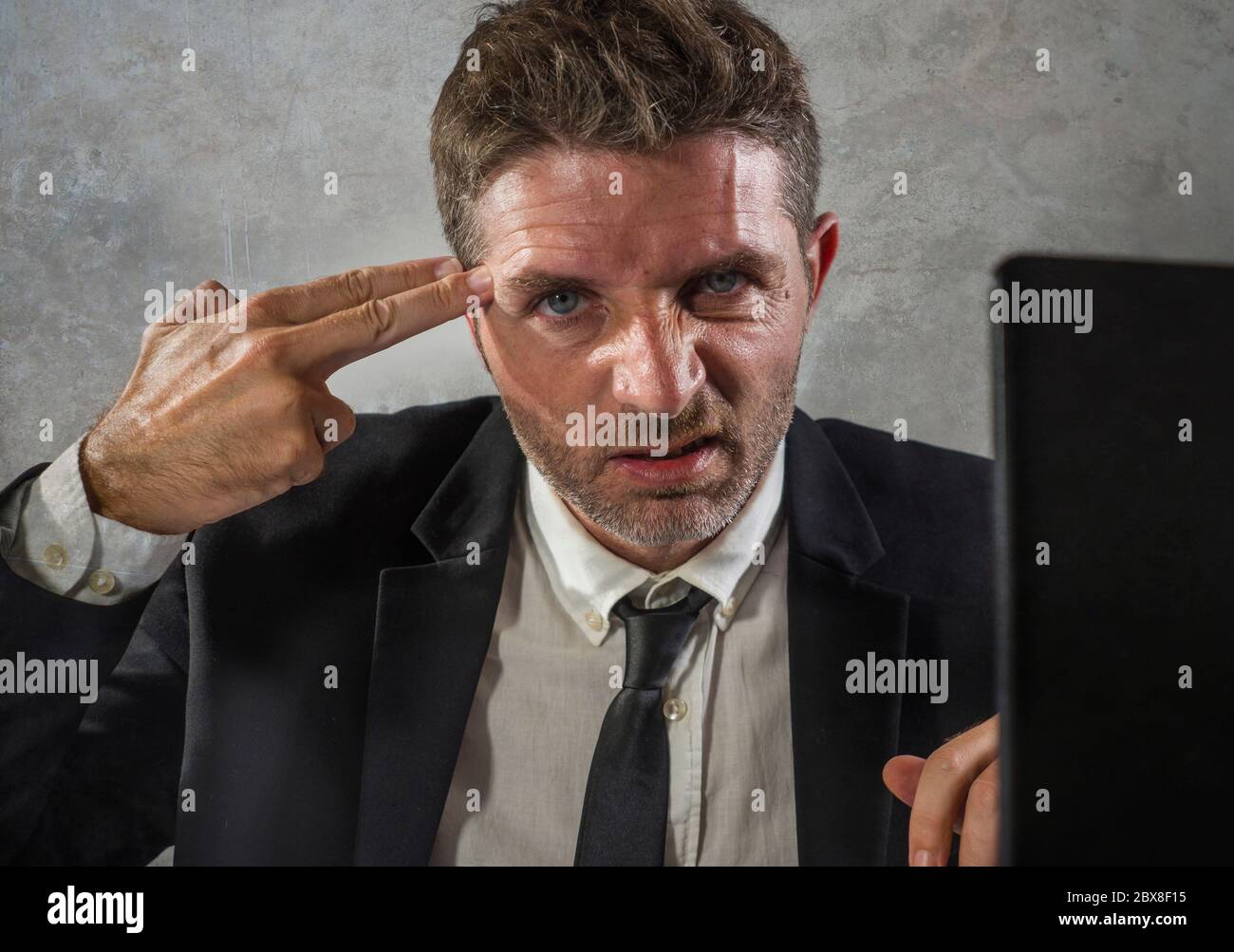Pointing gun at computer hi-res stock photography and images - Alamy