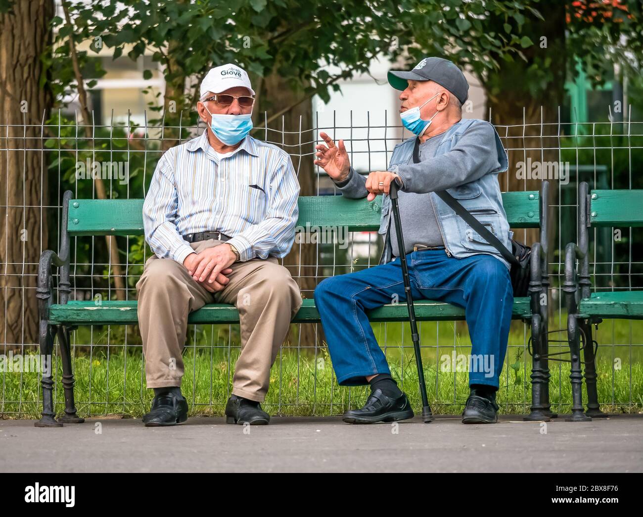 Bucharest/Romania - 05.23.2020: Two old man sitting on a bench in the ...