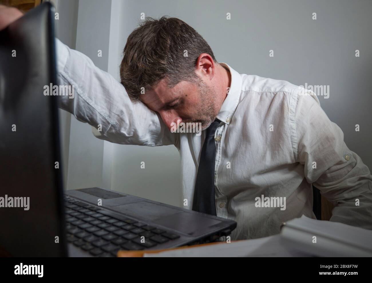 corporate business work stress - young desperate and frustrated ...