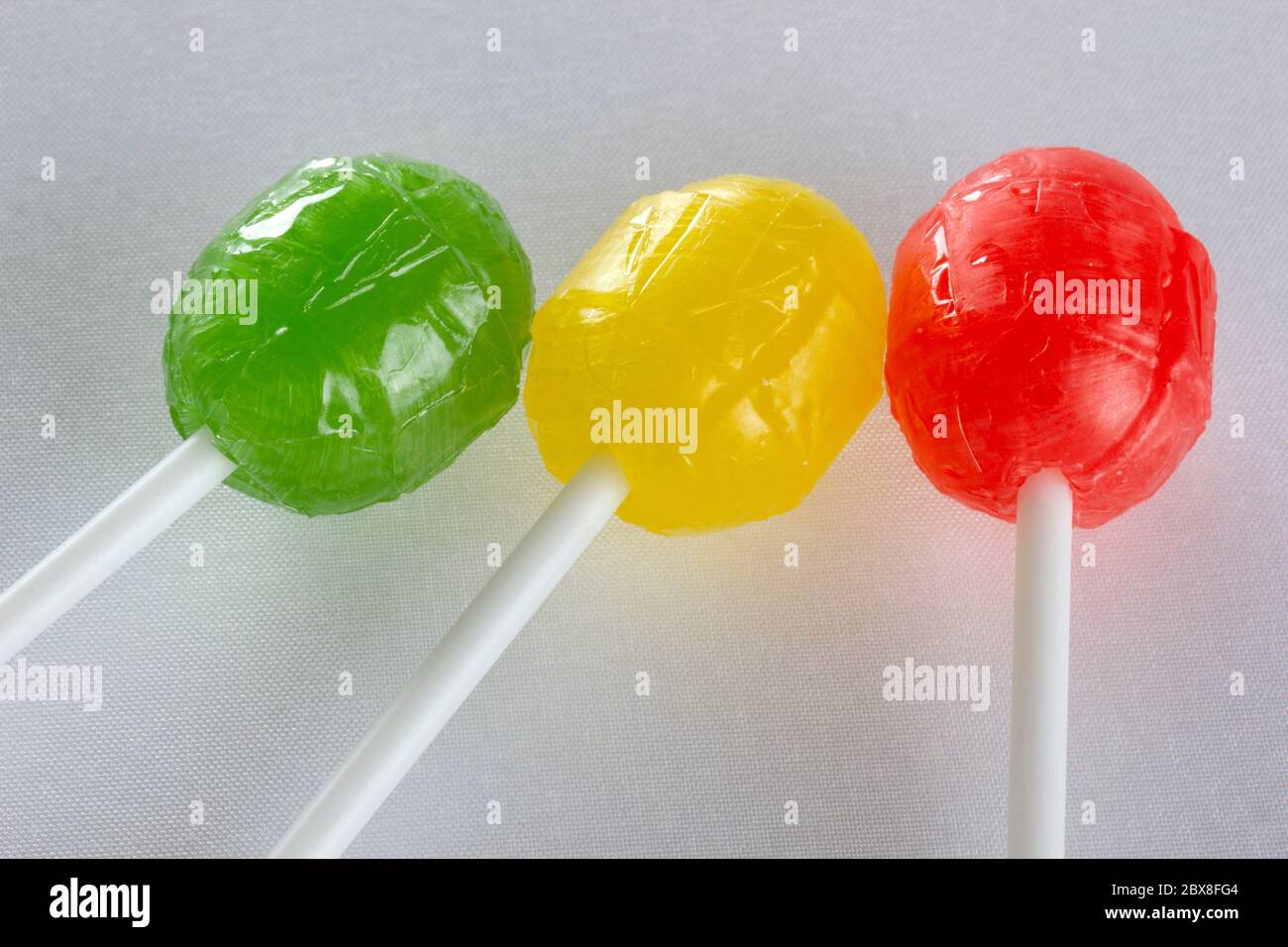 Three Lolipops, Green, Yellow, Red Stock Photo - Alamy