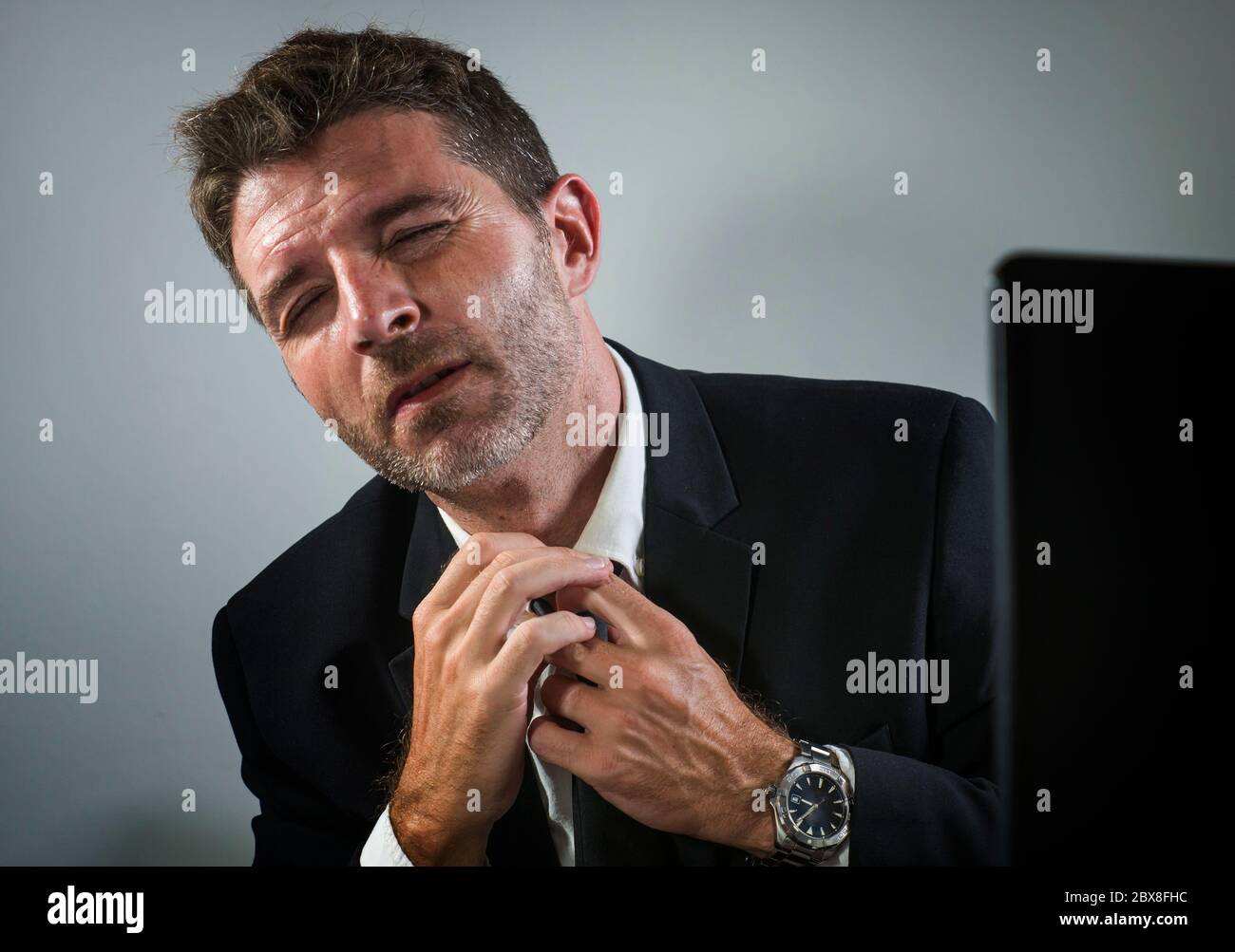 exhausted financial executive man suffering stress - corporate business ...