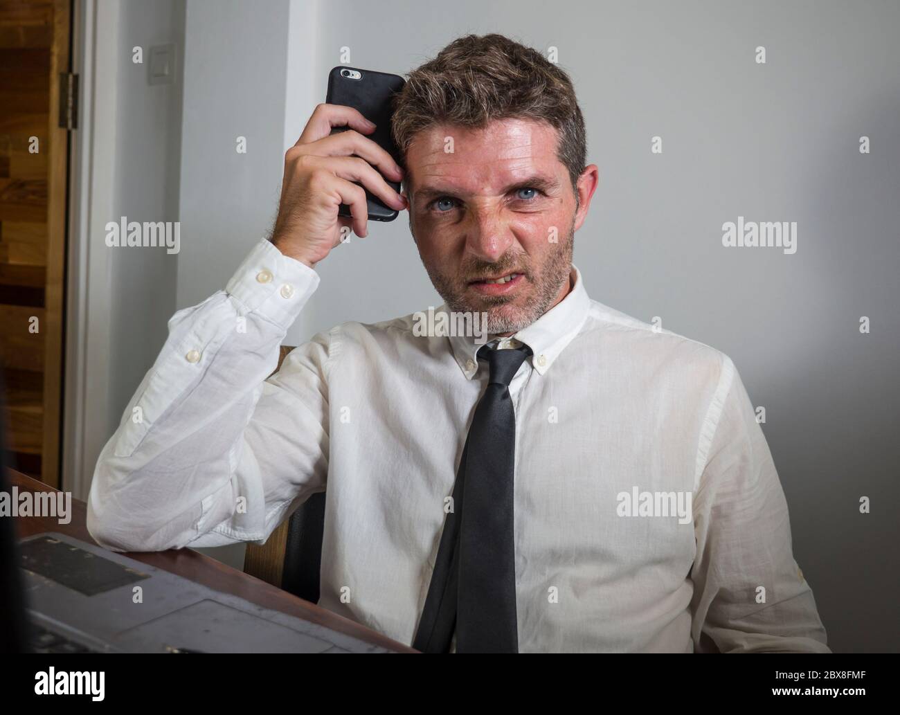 corporate company worker in stress - young desperate and frustrated ...