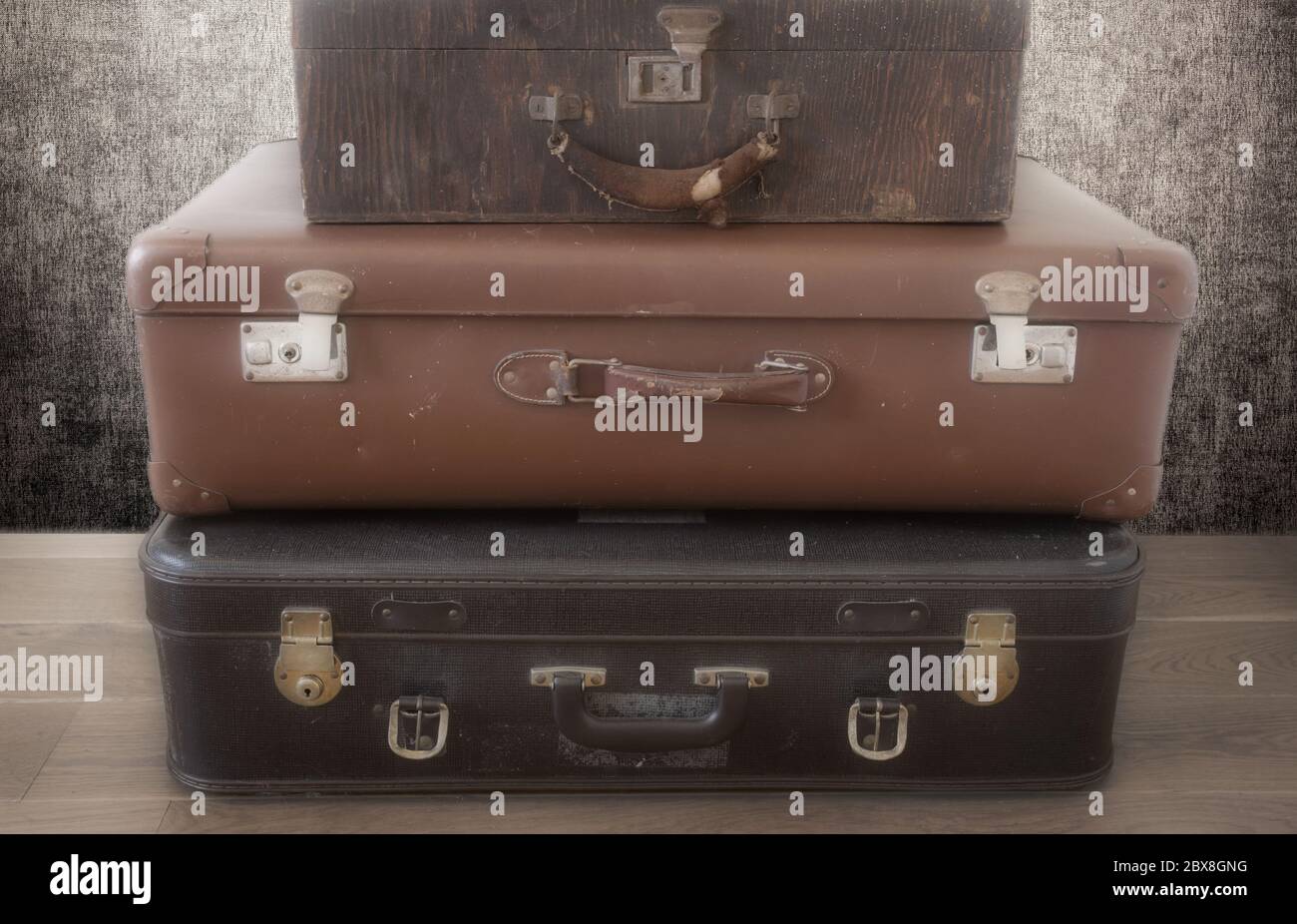 Old Vintage Suitcase in retro room on the floor, three piled suitcases ...