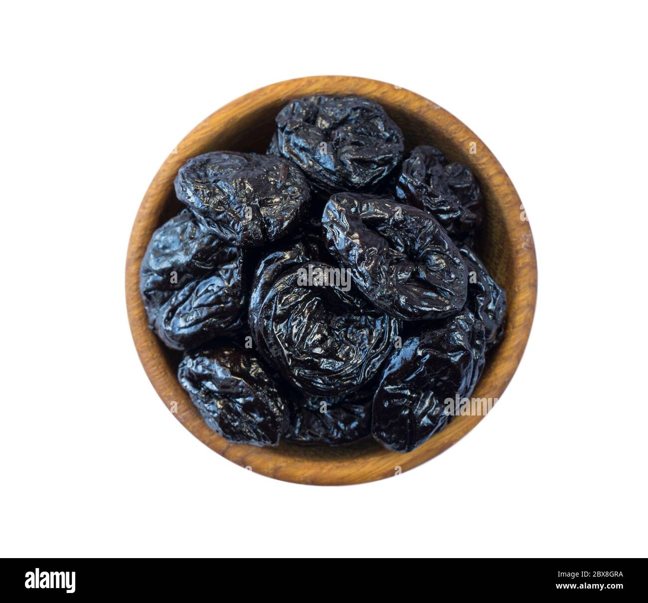 Dried prunes isolated on a white background. Dried prunes in a bowl on ...