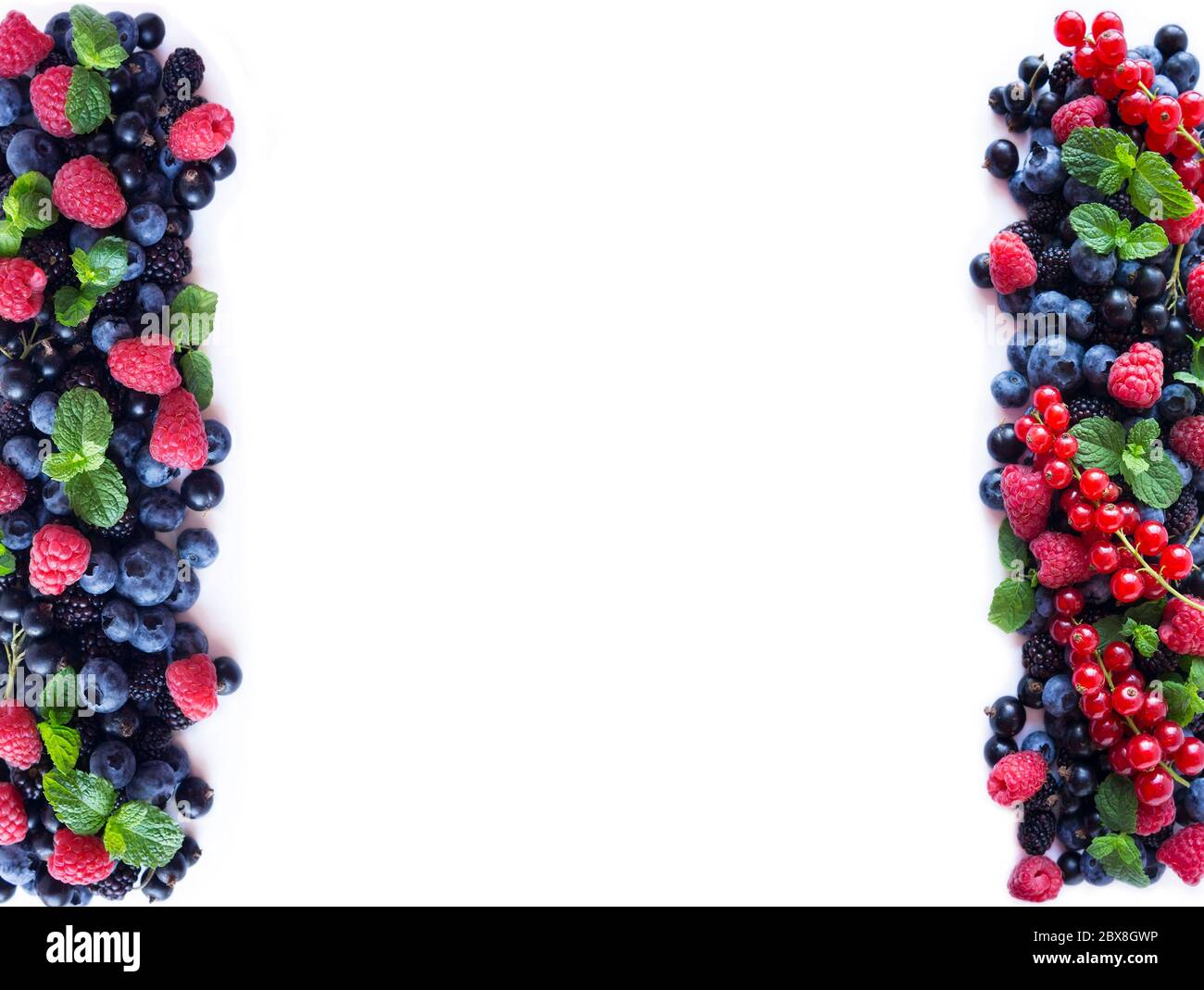 Mix berries and fruits at border of image with copy space for text ...