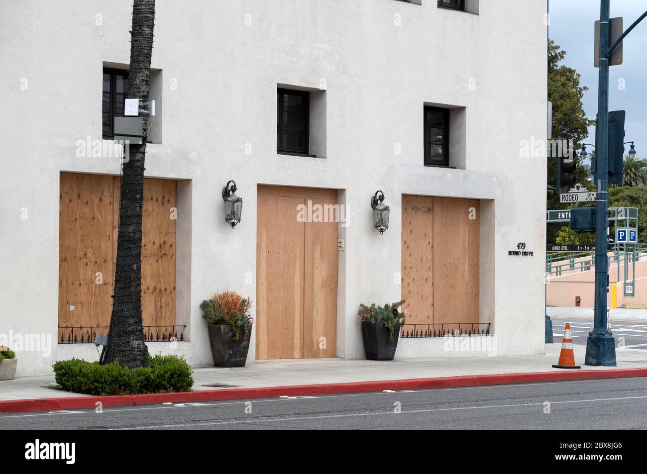 Beverly Hills, CA/USA - Boarded up shops on Rodeo Drive after being ...
