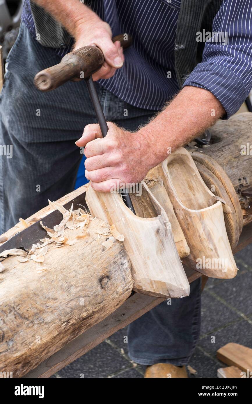 Traditional skill of manual making of Dutch wooden shoes Stock Photo ...