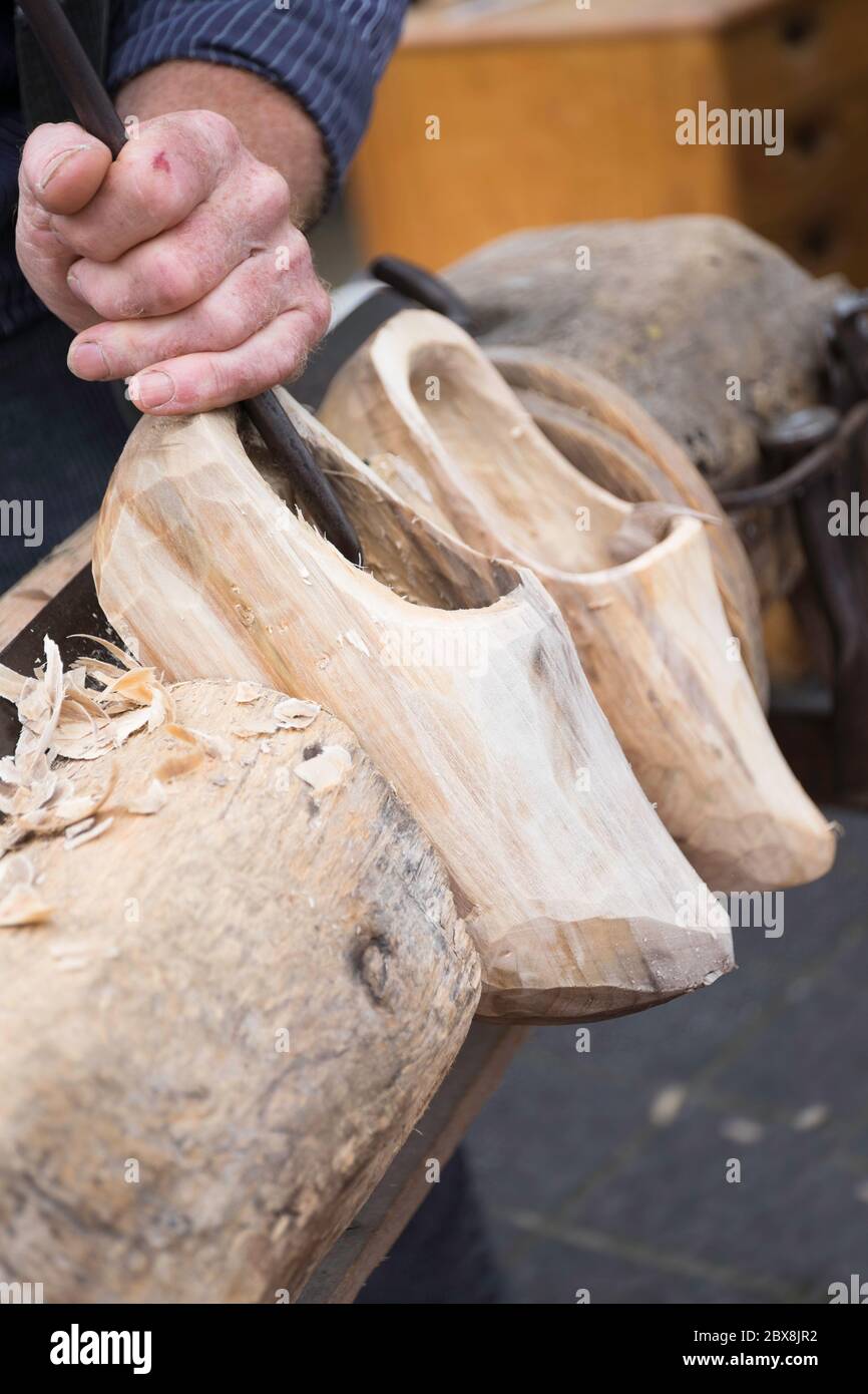Traditional skill of manual making of Dutch wooden shoes Stock Photo ...