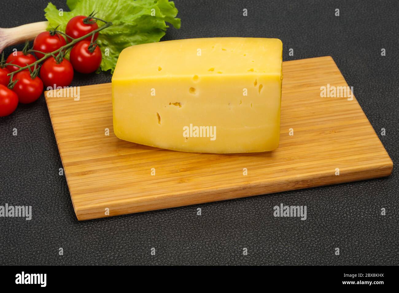 Swiss Hard yellow tasty cheese brick Stock Photo - Alamy
