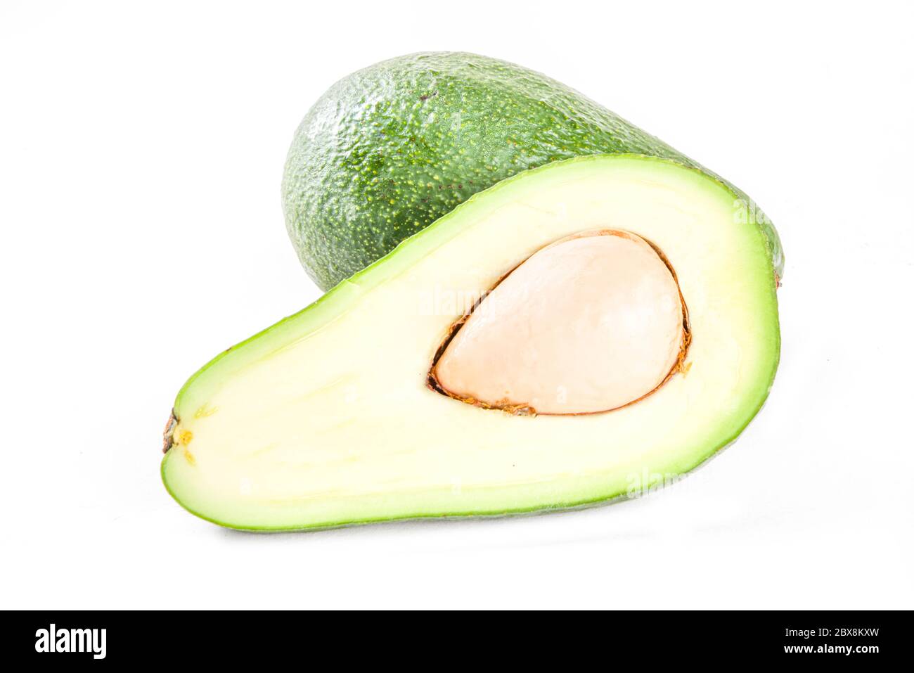 Raw organic avocado, whole and sliced avocado isolated on white ...