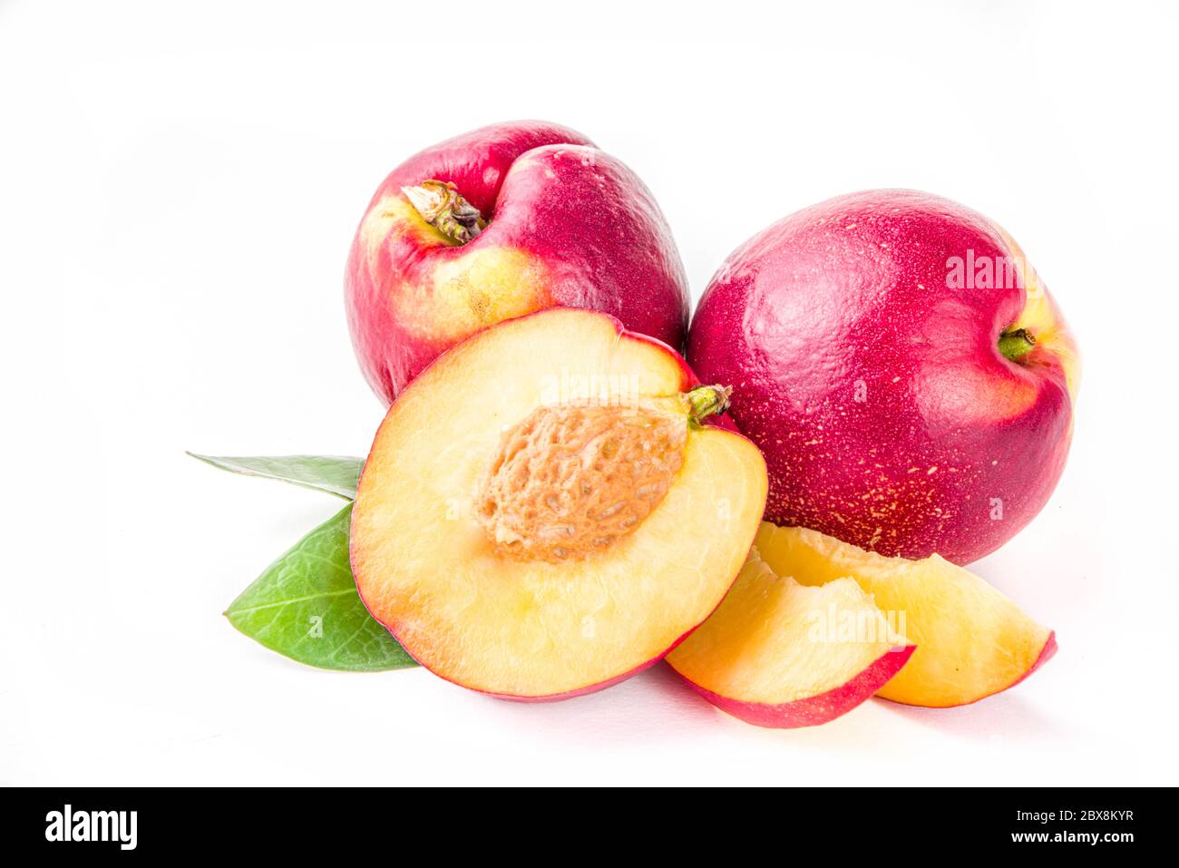Raw whole and half sliced peaches. Fresh summer peaches fruits isolated ...