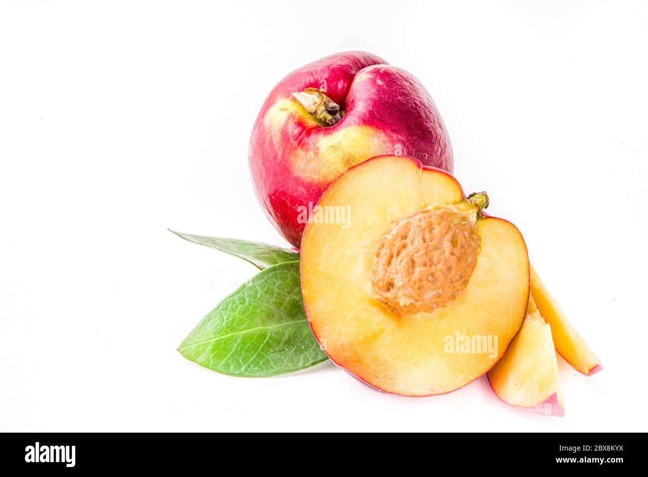 Raw whole and half sliced peaches. Fresh summer peaches fruits isolated ...