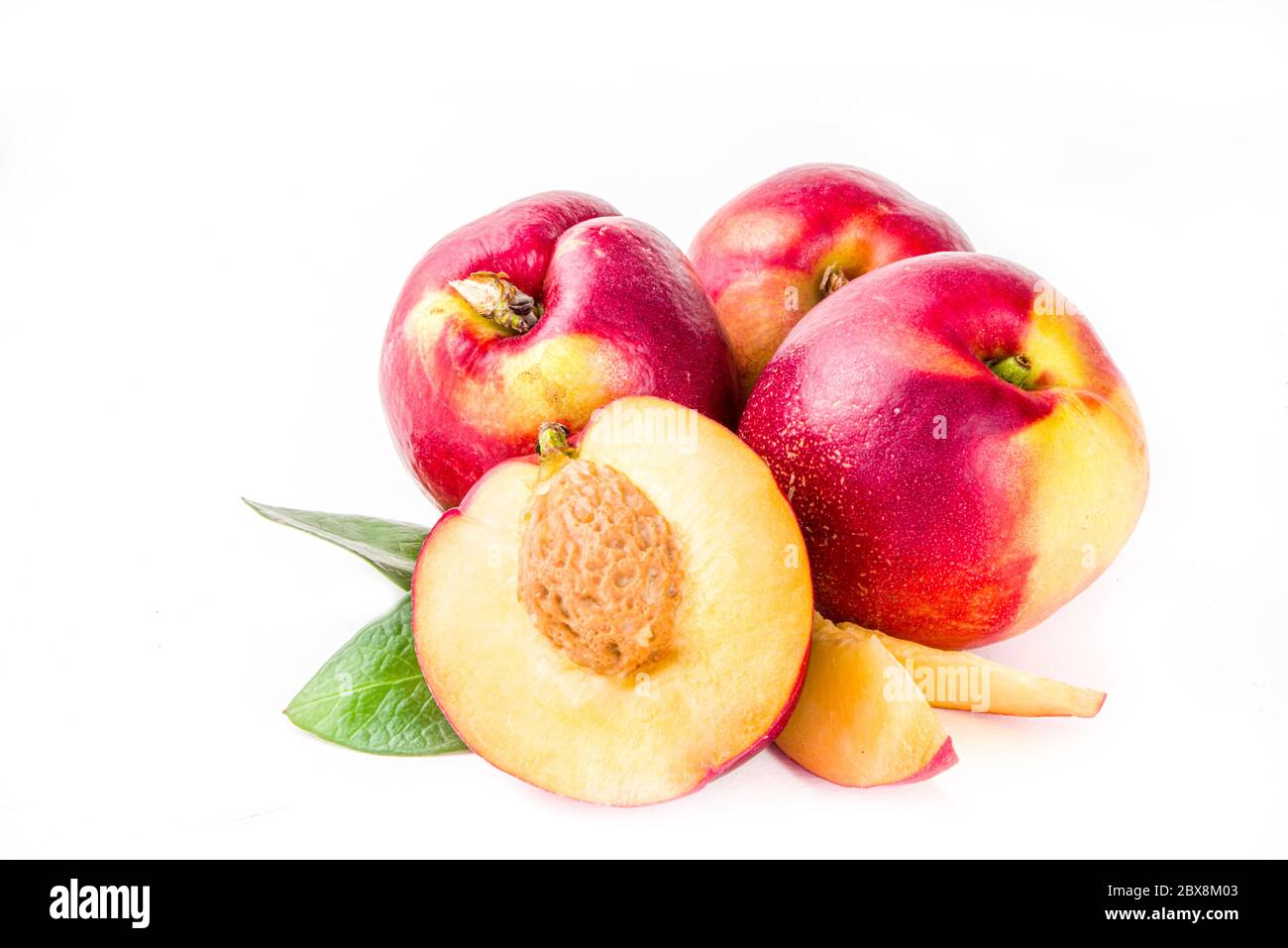 Raw whole and half sliced peaches. Fresh summer peaches fruits isolated ...