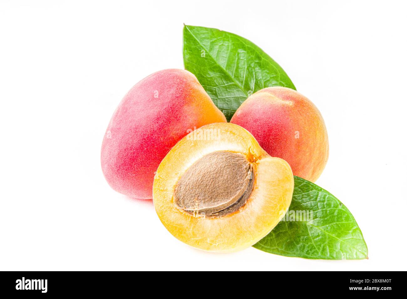Raw whole and half sliced apricots. Fresh summer apricots fruits ...