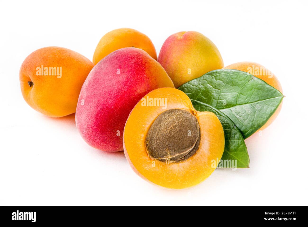 Raw whole and half sliced apricots. Fresh summer apricots fruits ...