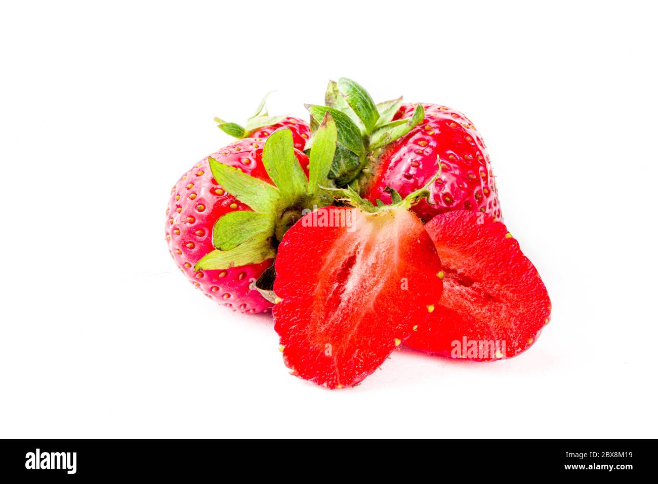 Raw whole and half sliced strawberry. Fresh summer strawberries fruits ...