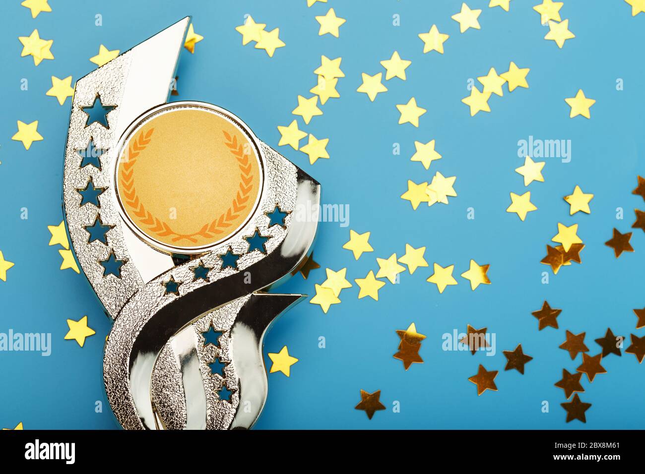 Superprize of gold with fireworks of stars on a blue background Stock ...