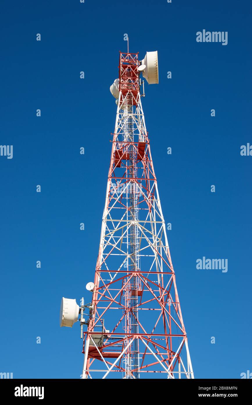 Telecommunications tower with clear blue sky Stock Photo - Alamy