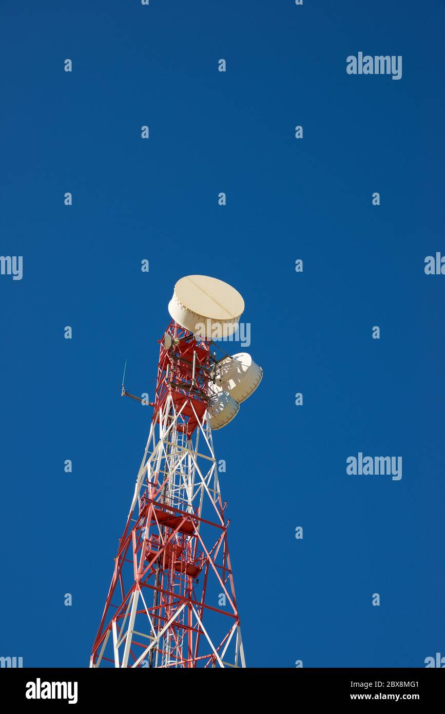 Telecommunications tower with clear blue sky Stock Photo - Alamy