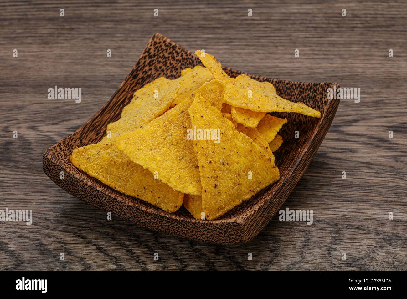 Mexican crunchy corn nachos triangle heap Stock Photo - Alamy