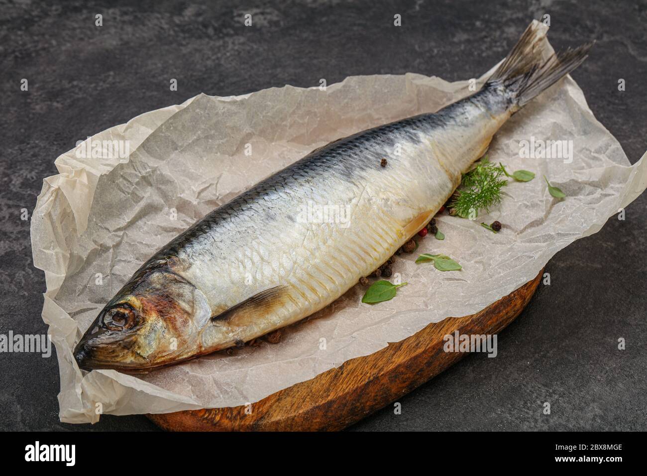 Salted Herring fish with pepper and spices Stock Photo - Alamy