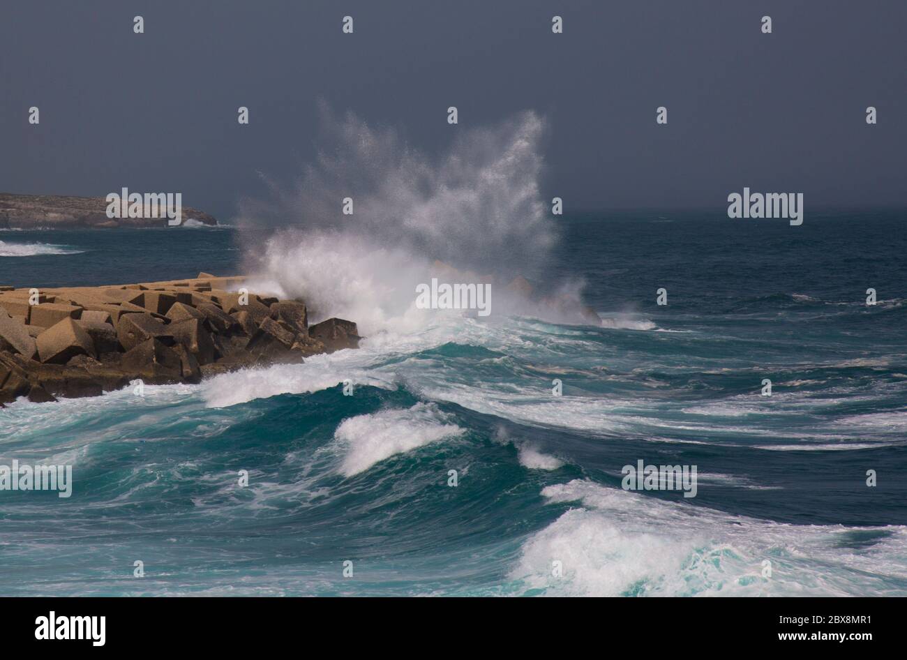 Wave smashing against a pier Stock Photo - Alamy